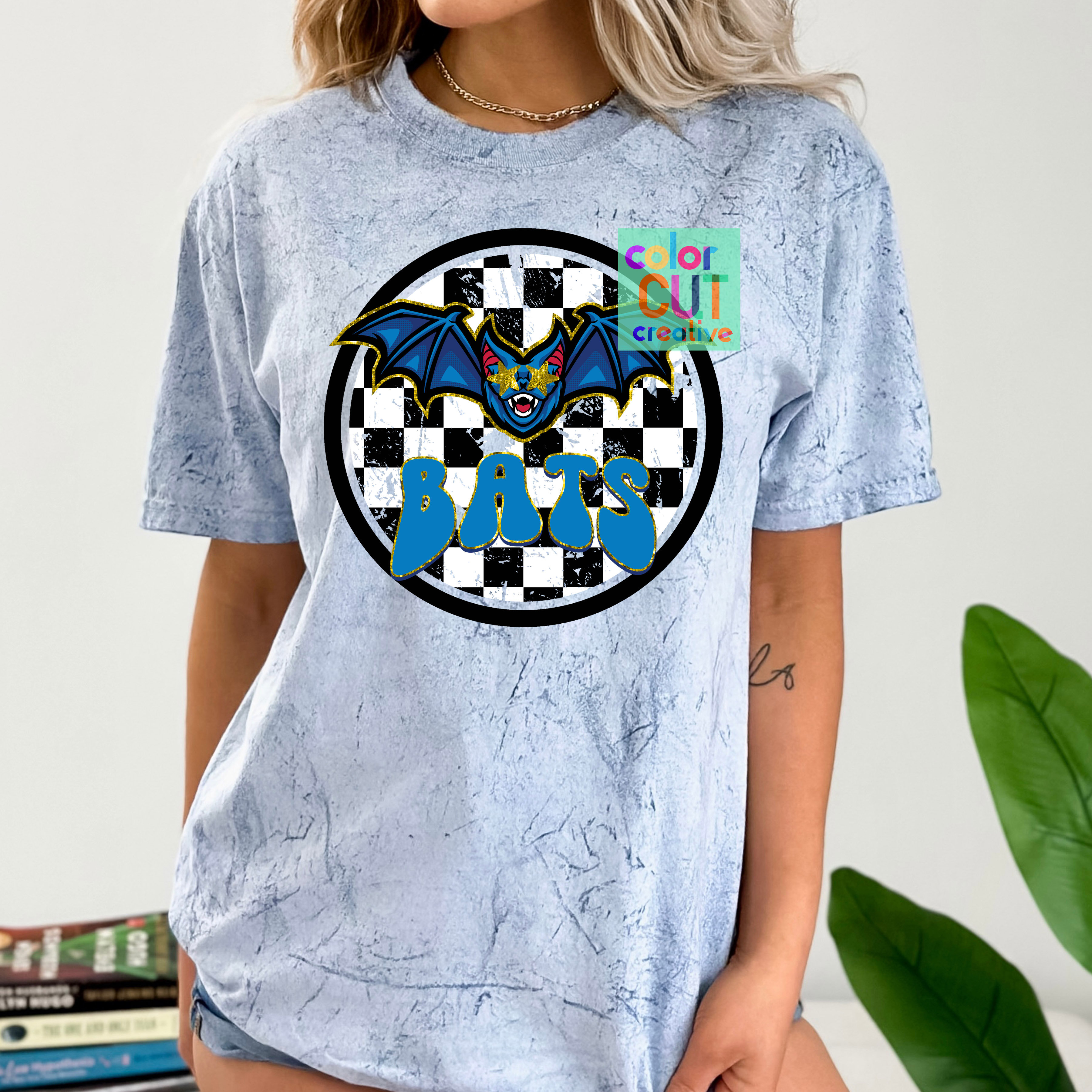 'Bats' Vibrant Blue Winged Creature on Checkered Circle Background ...